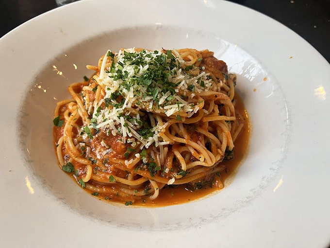 Spaghetti swimming in robust tomato sauce, the kind of dish that makes you understand why Italians gesticulate so much.