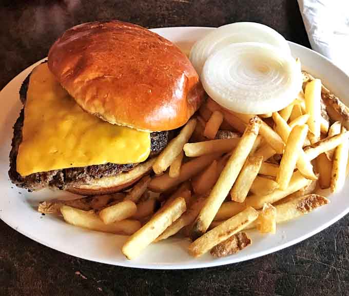 A classic cheeseburger with a mountain of fries proves sometimes simple done right beats fancy every time.