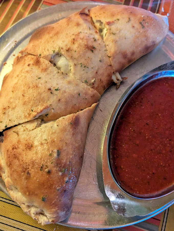 Satchel's calzones aren't just pizza's folded cousin &ndash; they're magnificent golden crescents stuffed with molten cheese and savory fillings.