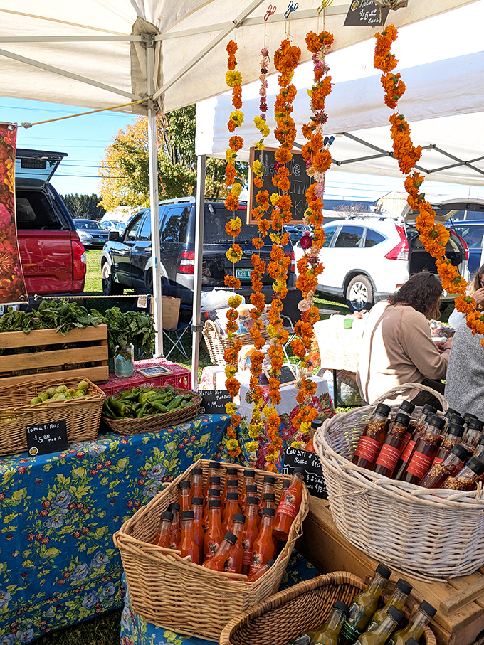 Vibrant flower garlands and fresh produce transform Grand Isle's farmers market into a feast for all senses.