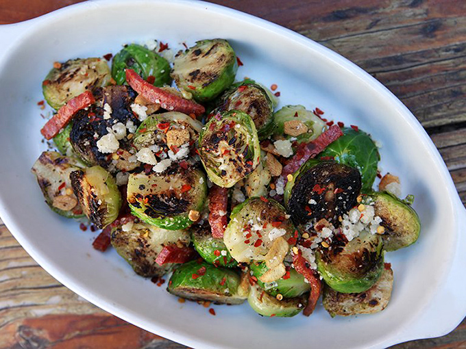 Brussels sprouts undergo a transformation from childhood nightmare to adult obsession, charred to sweet perfection and elevated with savory companions.