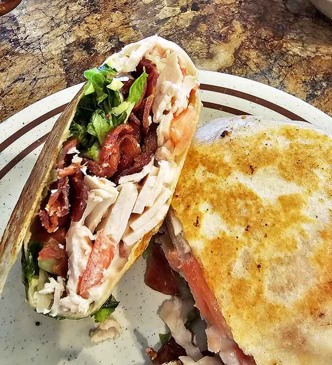The chicken club wrap showcases Tim's versatility, where diner classics get a fresh, handheld makeover.
