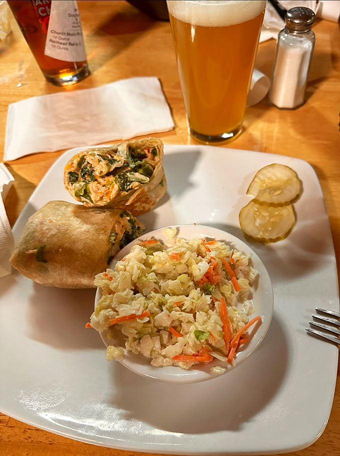 The chicken wrap offers a lighter alternative without sacrificing flavor, paired with house-made coleslaw that balances creamy and crunchy in every bite.
