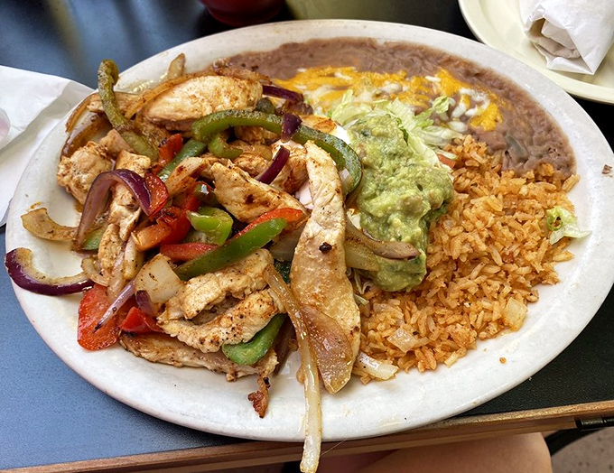 Sizzling chicken fajitas that arrive with that theatrical steam, promising a flavor performance worthy of a standing ovation.