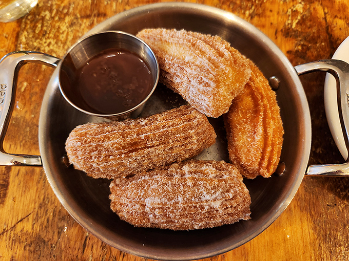 Churros that would make Madrid proud &ndash; crispy, sugar-dusted delights served with chocolate sauce that's practically drinkable on its own.