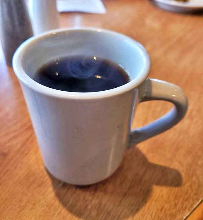 Coffee: The perfect companion to pie &ndash; served hot in a sturdy white mug that feels just right in your hands.