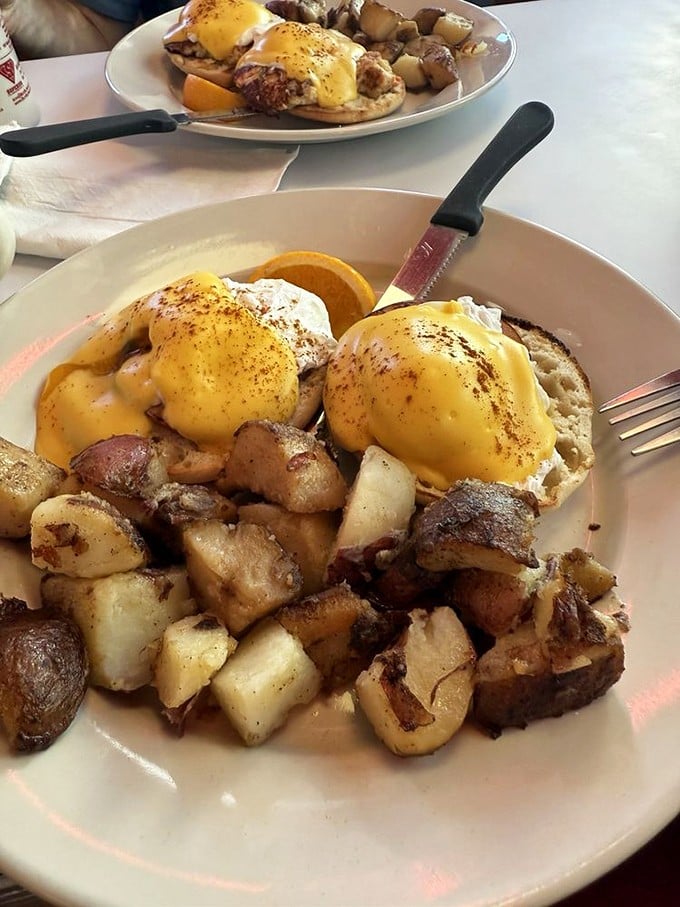 Golden-brown crab cakes crowned with poached eggs and hollandaise &ndash; Neptune himself would approve of this breakfast.