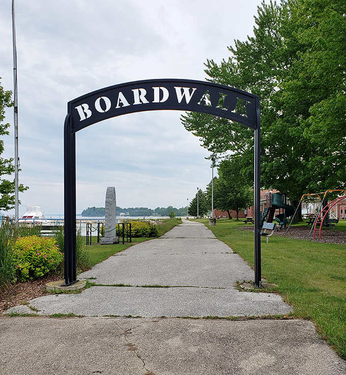 The Boardwalk entrance frames a path to waterfront adventures, where Lake Michigan's shoreline awaits just beyond the archway.
