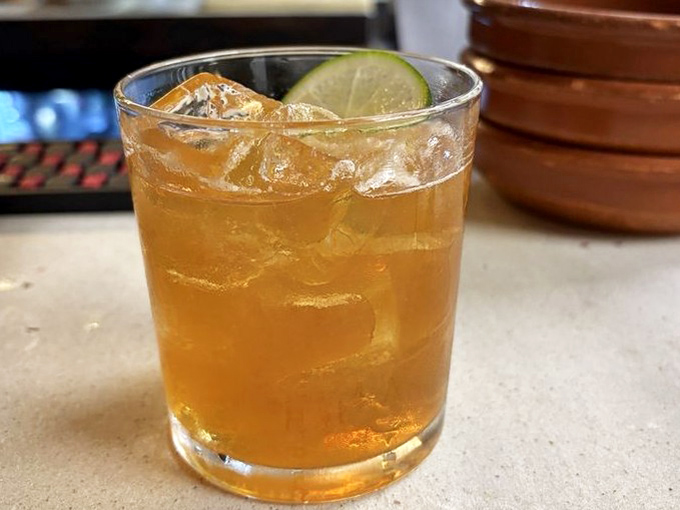 The Dayo cocktail glows amber in the morning light, garnished with a lime wedge &ndash; proof that Chaval takes their liquid brunch companions as seriously as their food.