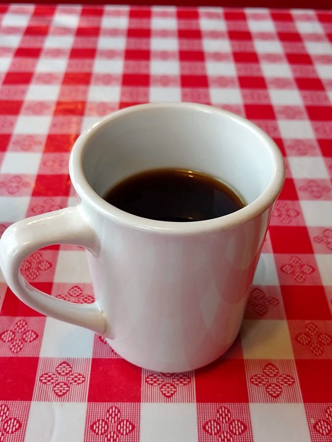 There's something almost meditative about a simple cup of diner coffee served on a classic red-checkered tablecloth &ndash; hot, strong, and endlessly refillable.