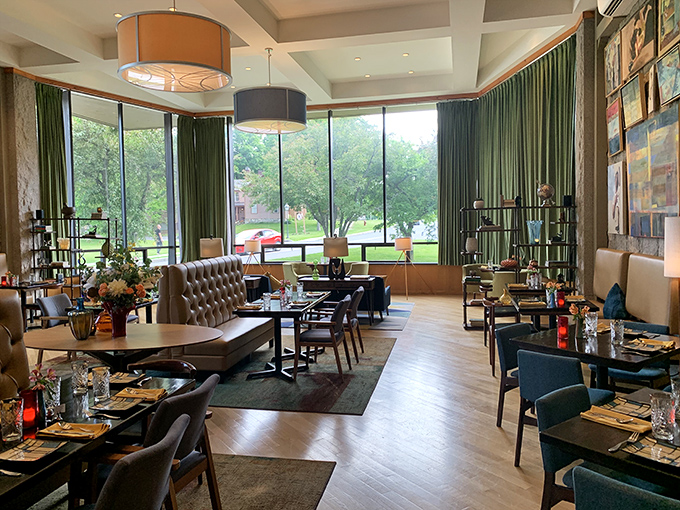 Floor-to-ceiling windows flood the dining area with natural light, creating a space where the Vermont landscape becomes part of your dining experience.