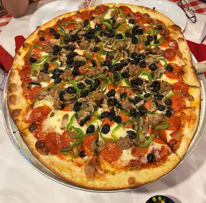 Share a slice of this loaded "Italian Day Dream" pizza, packed with fresh toppings and savory flavors.