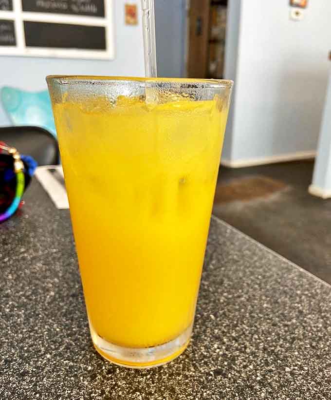 Fresh-squeezed orange juice glows like liquid sunshine, promising vitamin C and the possibility of champagne for a proper morning celebration.