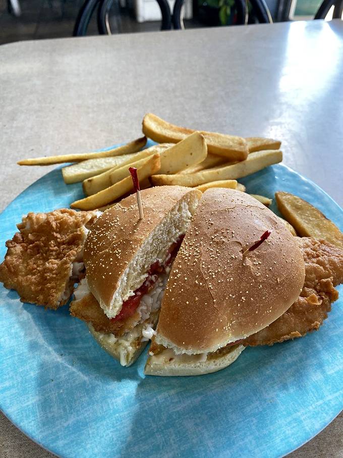 Fresh catch nestled in a soft bun with just the right accompaniments &ndash; proof that seafood doesn't need fancy preparation to shine.