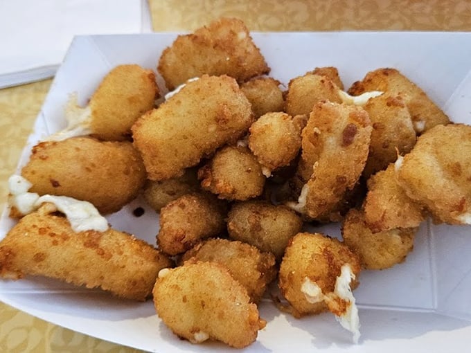 Wisconsin cheese curds fried to golden perfection &ndash; stretchy, gooey pockets of joy that make the perfect burger companion.