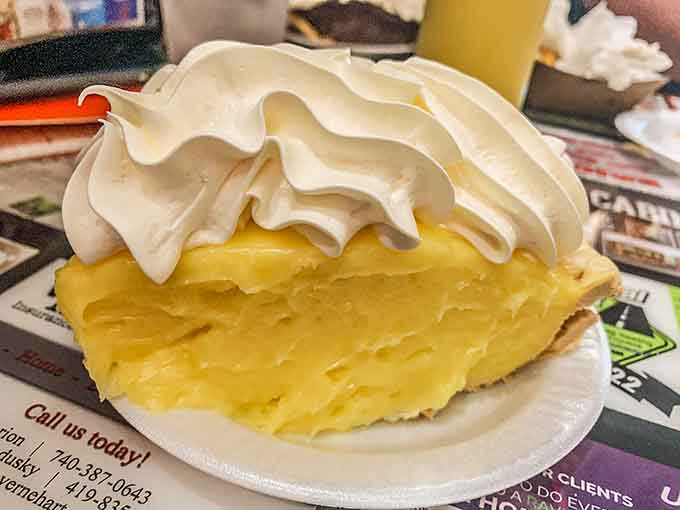 Lemon meringue pie stands tall and proud, its fluffy peaks hiding tart, sweet filling underneath.