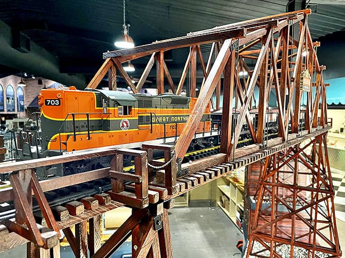 All aboard! This G-scale model train chugs along overhead, captivating train enthusiasts while shoppers browse below.
