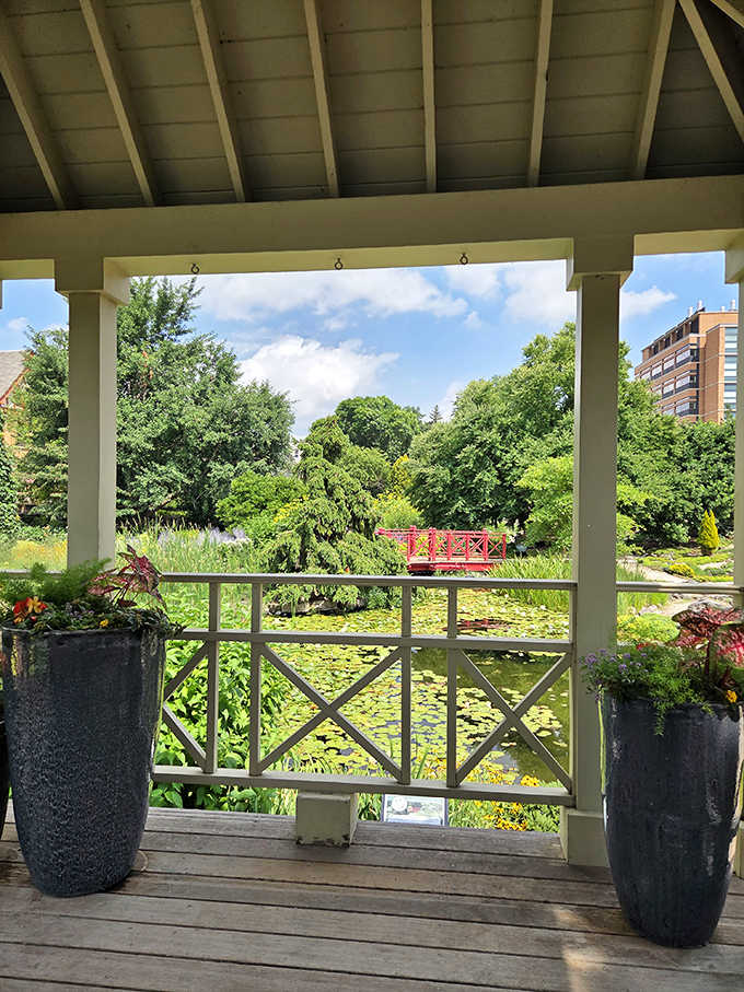 From this gazebo vantage point, the pond reflects sky and structure alike&mdash;doubling the beauty with mirror-perfect precision.