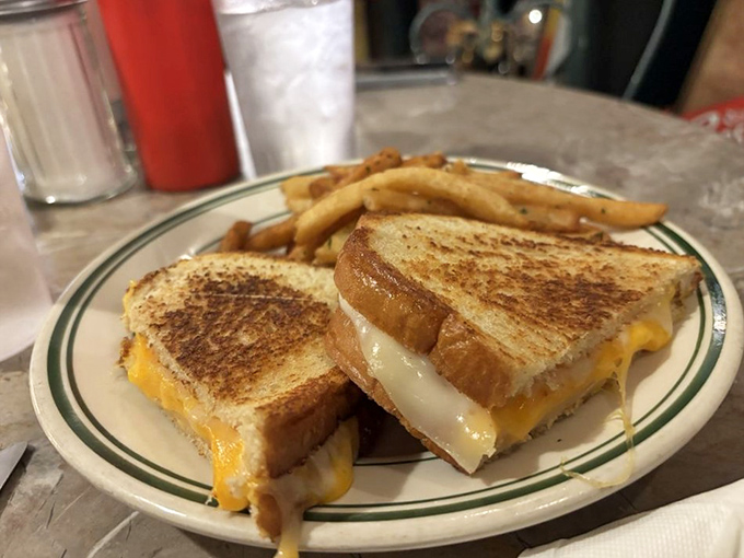 Golden-brown perfection meets melty cheese magic in this humble sandwich that somehow tastes better in a vintage diner.