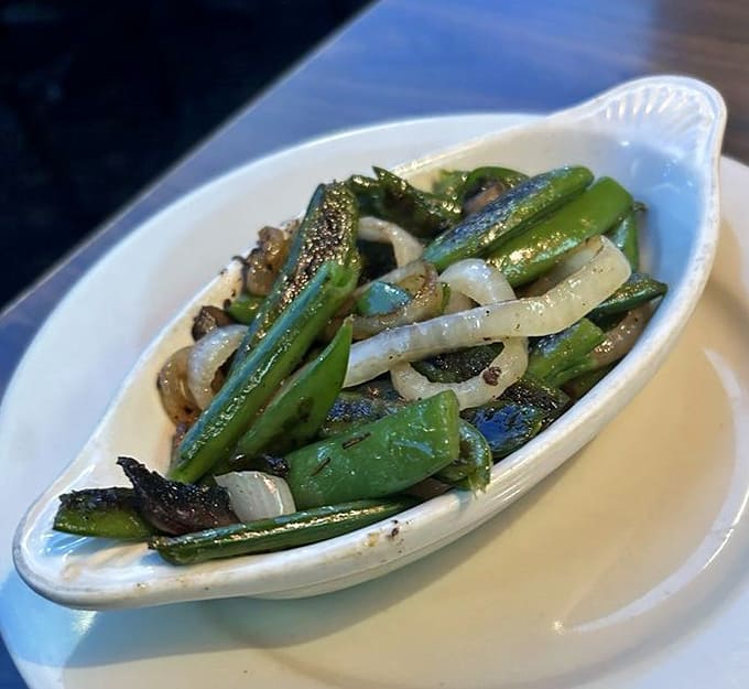 These aren't ordinary vegetables &ndash; Kelly's grilled asparagus and onions arrive perfectly charred, seasoned, and ready to convert even dedicated carnivores.