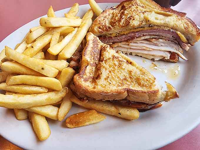 When your sandwich requires architectural support and comes with a mountain of fries, you know you're in good hands.