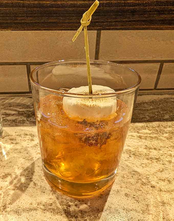 A perfectly crafted cocktail with a playful garnish, because even your drink deserves to look Instagram-worthy here.