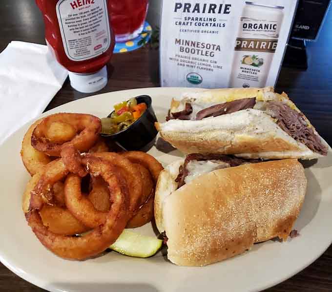 Hearty sandwich with all the fixings and onion rings that deserve their own fan club.