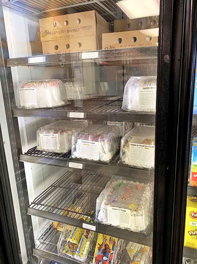 The freezer case displays ice cream cakes waiting to make someone's celebration even sweeter &ndash; birthday candles sold separately, memories included free.