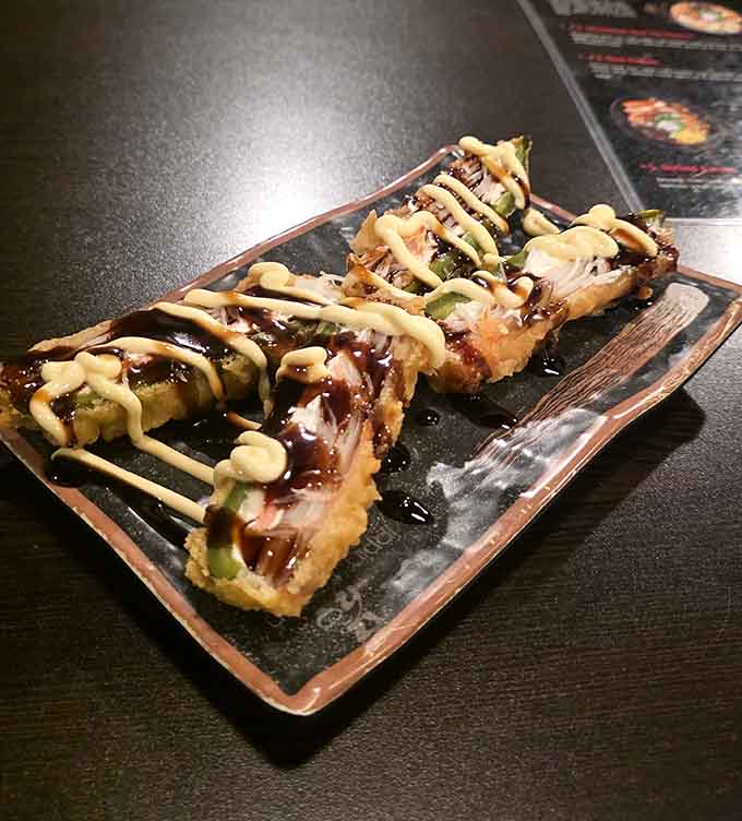 These crispy, saucy bites of perfection prove that sometimes the best things come in small, fried, drizzled packages.