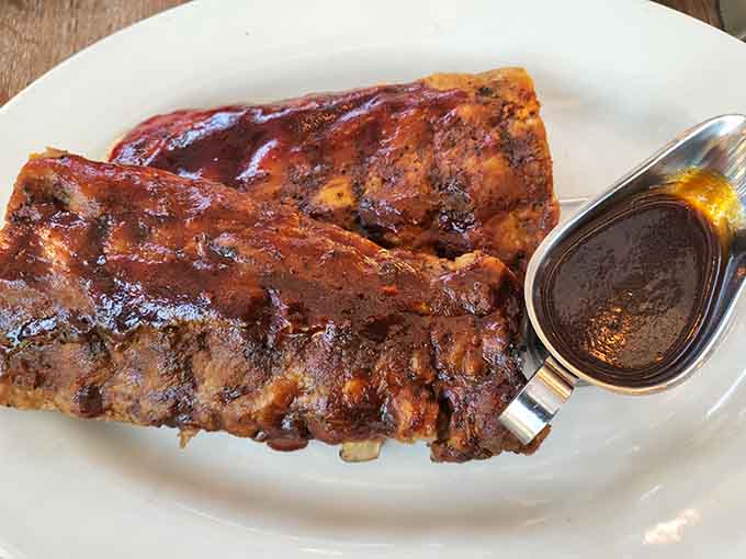 BBQ ribs glazed to sticky perfection, the kind that require extra napkins and zero regrets about the mess.