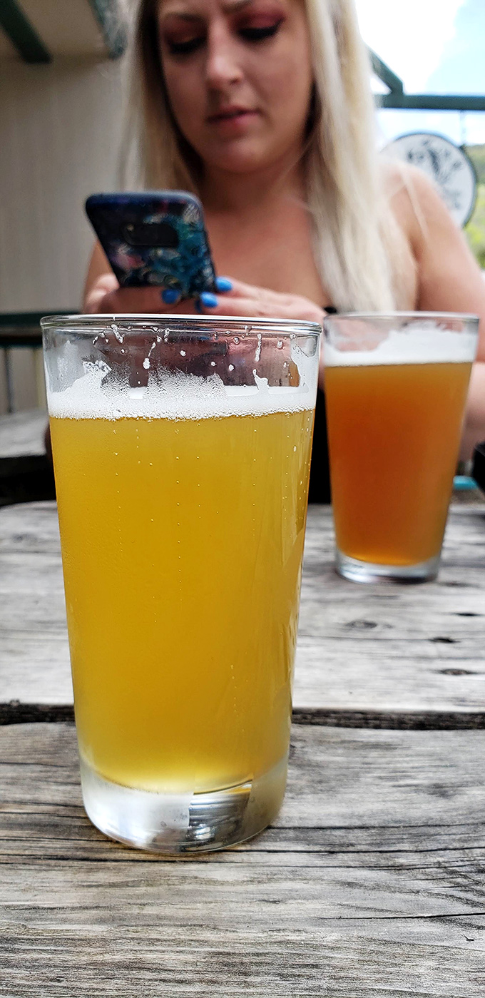 Golden craft beer catching the light &ndash; the perfect companion to cut through rich, smoky flavors and reset your palate between bites.