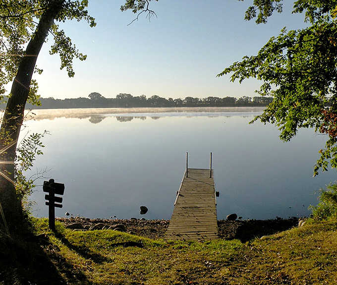 Morning mist rises from the lake like nature's own special effect&mdash;no CGI required for this magic.