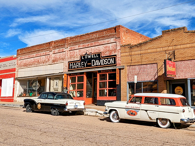 Vintage vehicles park outside Lowell's Harley-Davidson, creating a time-capsule scene that photographers and nostalgia-seekers can't resist capturing.