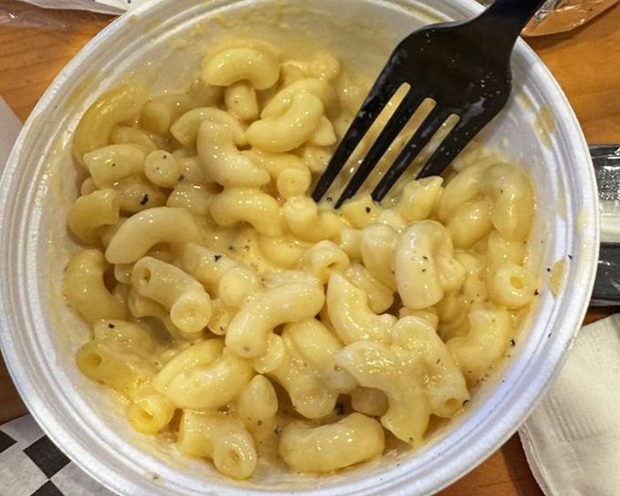 Creamy mac and cheese that doesn't just accompany the barbecue&mdash;it demands equal attention with its velvety, cheesy perfection.