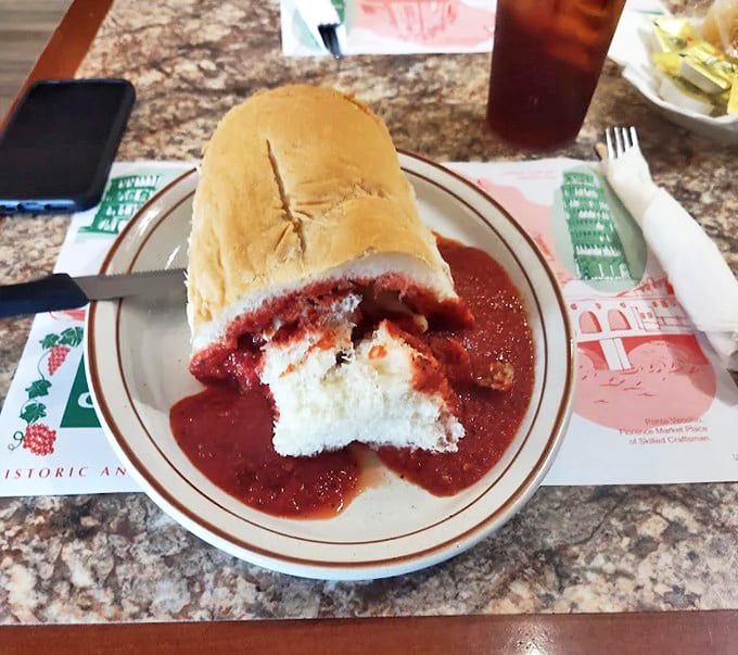 A crusty roll embraces plump, herb-flecked meatballs and signature sauce in a beautiful mess that's worth every napkin.