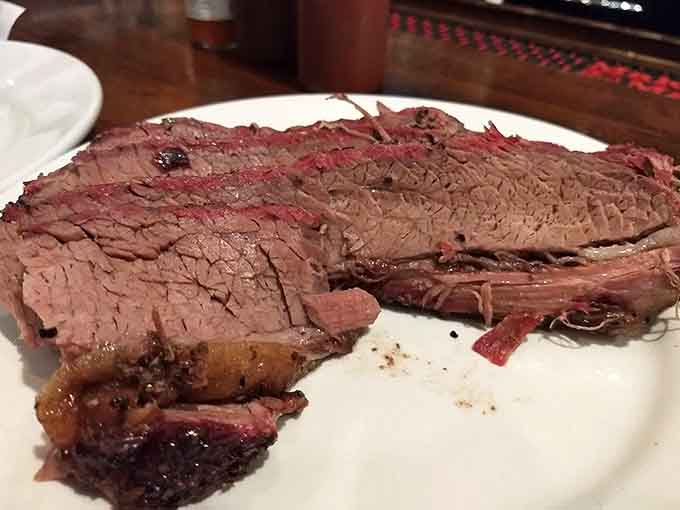 That pink smoke ring and tender texture tell you everything you need to know about properly smoked brisket done right.