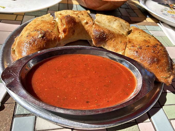 Not a sad afterthought but a magnificent crescent of joy &ndash; this calzone looks like it's about to whisper Italian secrets.