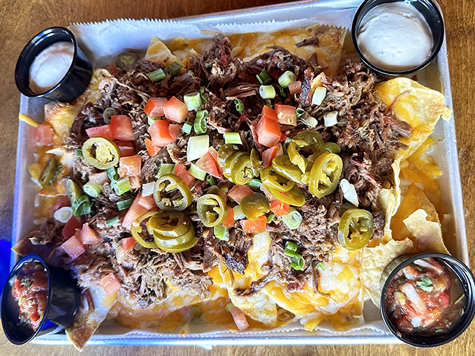 Nachos that require a topographical map to navigate &ndash; layers of chips, brisket, jalape&ntilde;os, and enough cheese to make Wisconsin jealous.