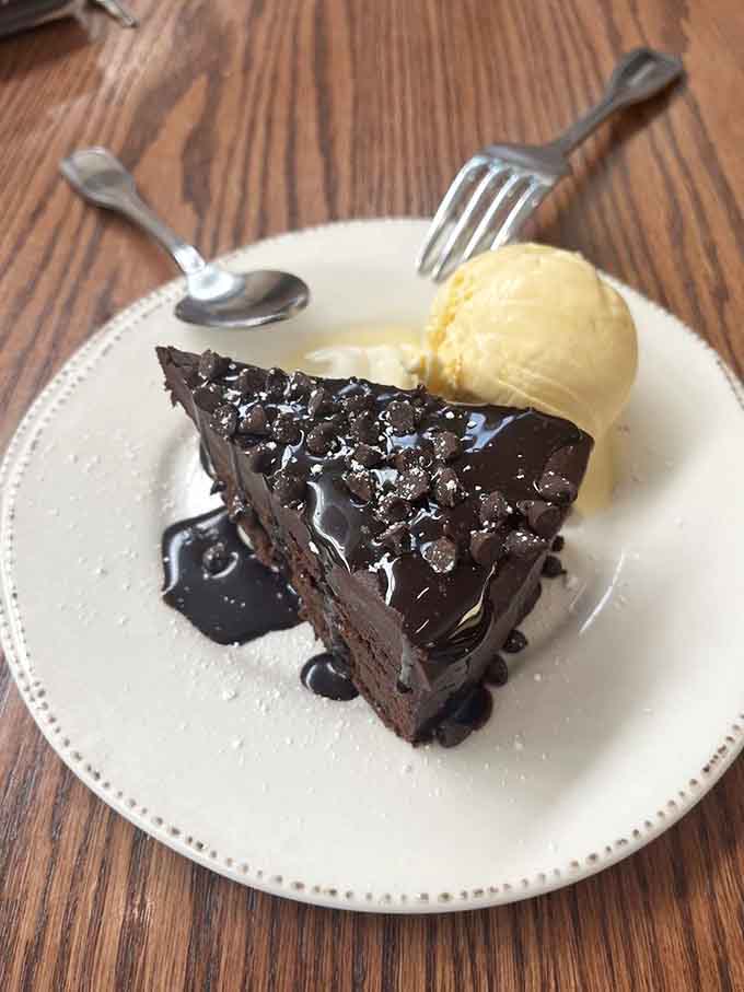 This chocolate cake slice, dark and glossy with a scoop of vanilla ice cream, is basically a hug from your grandmother in dessert form.