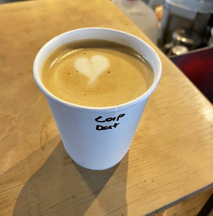 A heart-adorned foam top proves that plant-based milk doesn't mean sacrificing barista artistry or silky texture.