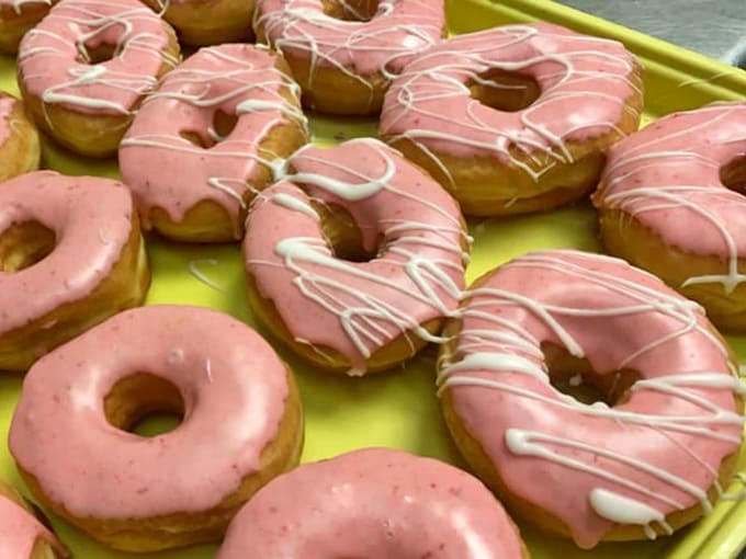 Pretty in pink and covered in smooth strawberry icing, these donuts look like they escaped from a Barbie dreamhouse bakery.