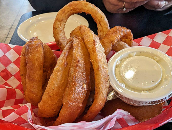 Golden rings of crispy perfection &ndash; these onion rings aren't sidekicks but co-stars, worthy of their own spotlight moment in Fat Willy's culinary show.