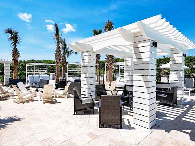 A brick-walled urban oasis where metal tables await al fresco diners seeking sunshine, fresh air, and the perfect excuse for "just one more."