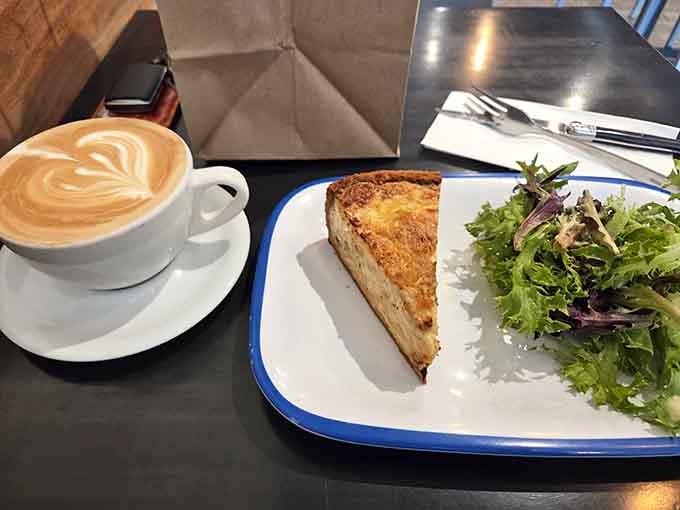 Perfect quiche meets expertly crafted latte art, proving that some partnerships are simply meant to be enjoyed together slowly.