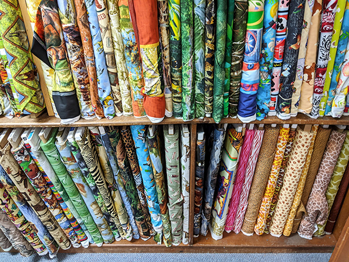 Patterns and possibilities leap from every shelf, each fabric telling a different story waiting to be stitched.