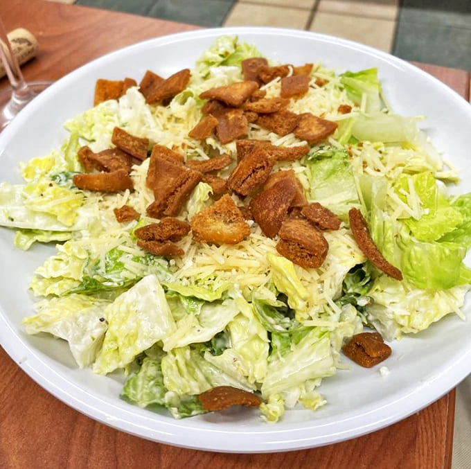 Proof that even the greens get special treatment here &ndash; those homemade croutons are the unsung heroes of Pinegrove's salad game.
