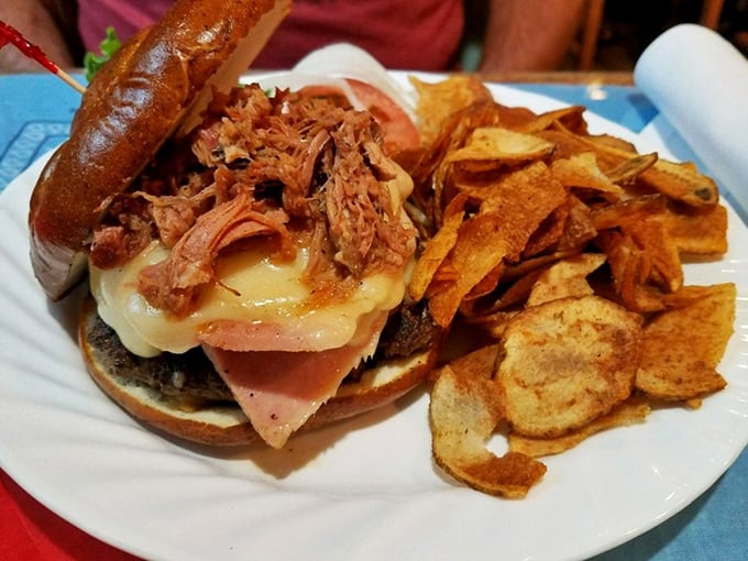 Architecture meets appetite! This towering creation demands a strategy before the first bite&mdash;and napkins, lots of napkins.
