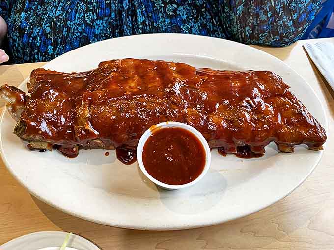 These ribs have clearly been slow-dancing with smoke and spice until they reached that perfect tender-but-not-falling-apart sweet spot.