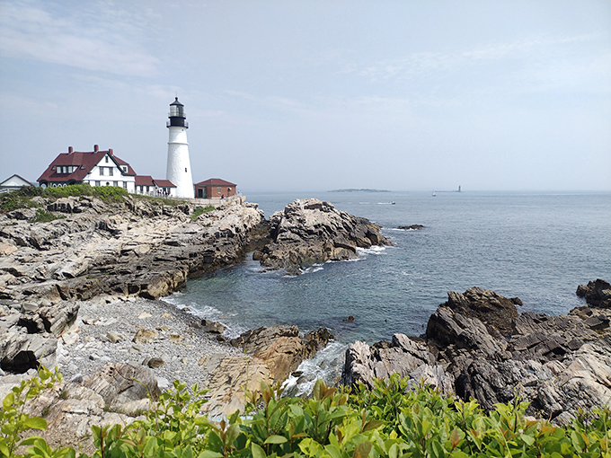 Jagged coastal rocks create nature's perfect foundation for this iconic structure, with waves that have been applauding the lighthouse for over two centuries.