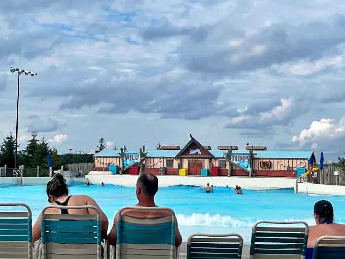 The universal posture of water park patrons &ndash; slightly damp, mildly sunburned, and completely content in their temporary aquatic kingdom.